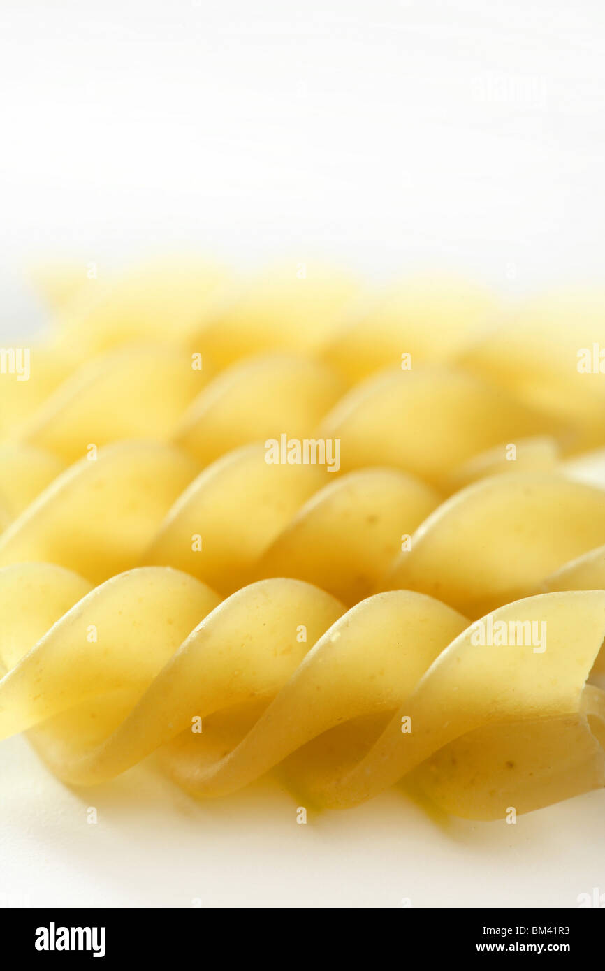 Spiral fusilli dried pasta macro over white studio background Stock ...