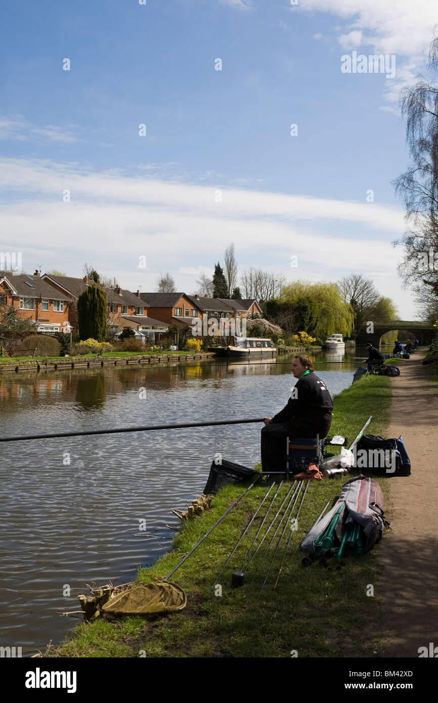 Coarse fisherman; View down the Leeds Liverpool canal inland waterway ...