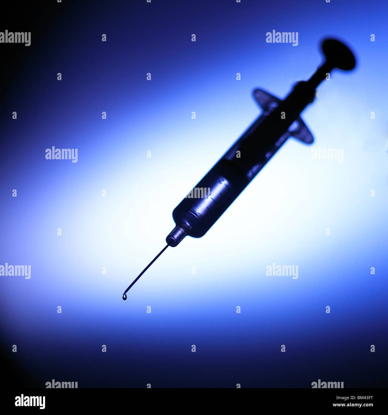 Syringe with drip Stock Photo - Alamy