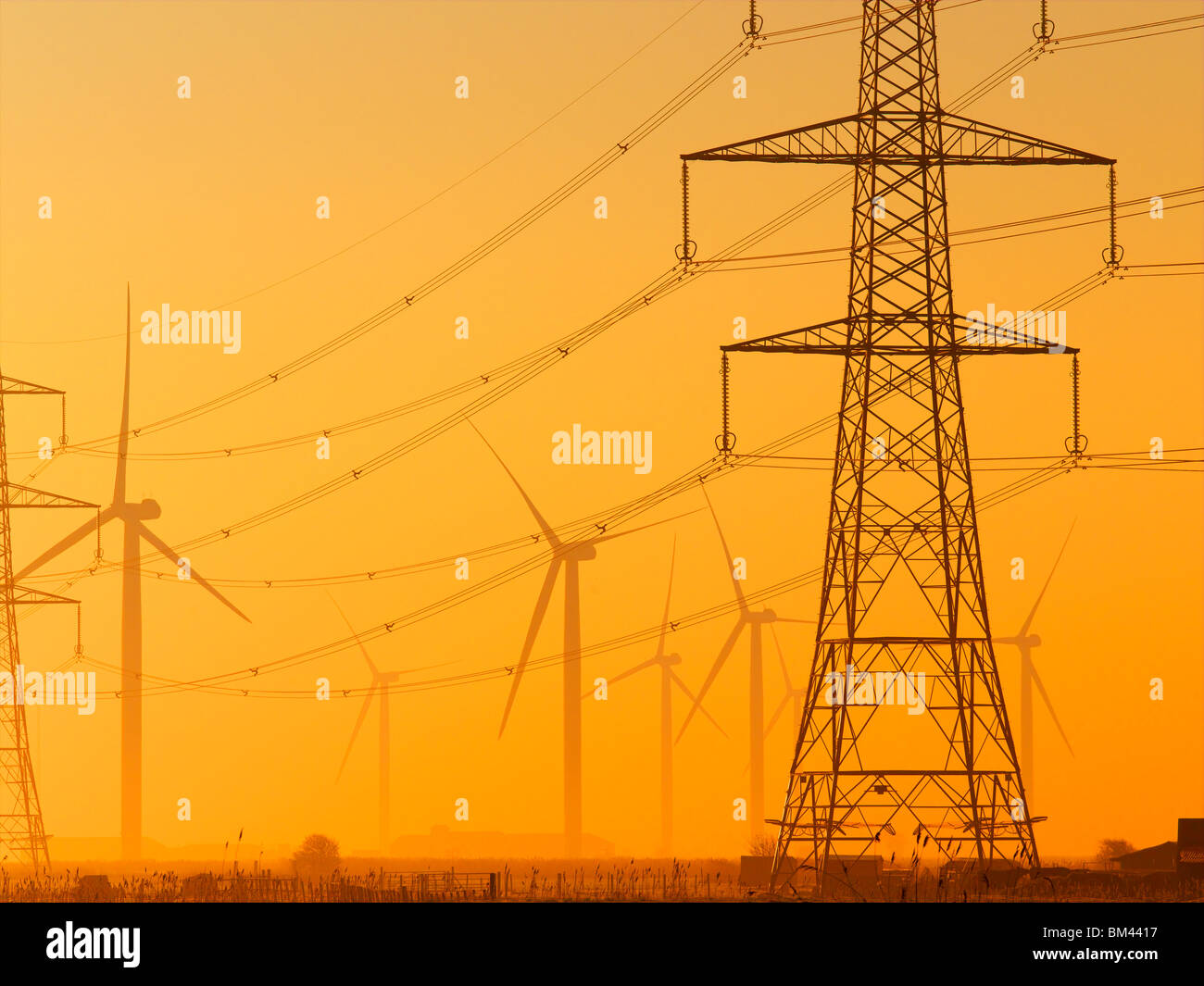 Electricity Pylons & Wind Farm Stock Photo - Alamy