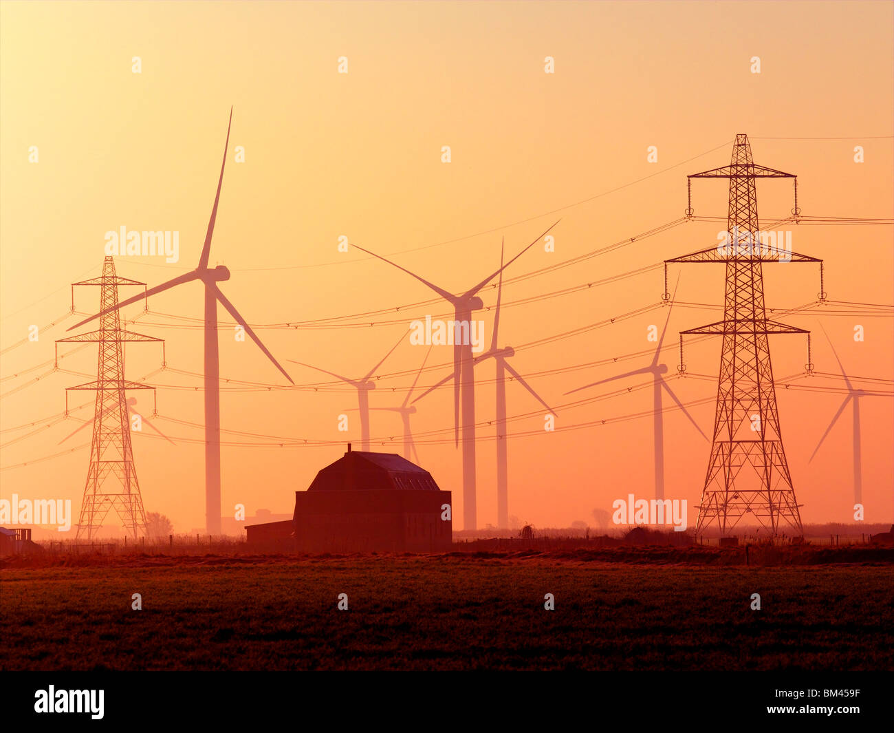 Electricity Pylons & Wind Farm Stock Photo - Alamy