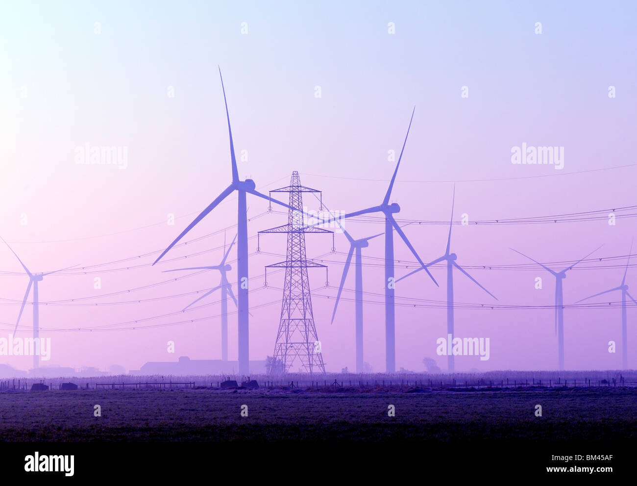 Electricity Pylons & Wind Farm Stock Photo - Alamy