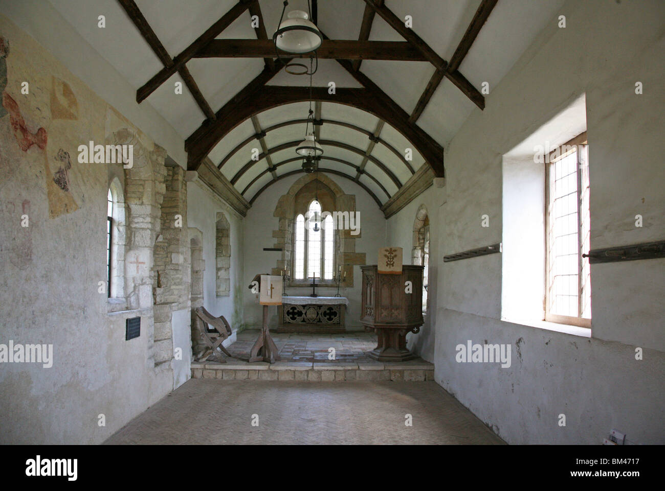 Pulpit in the disused church in the attractive thatched village of ...