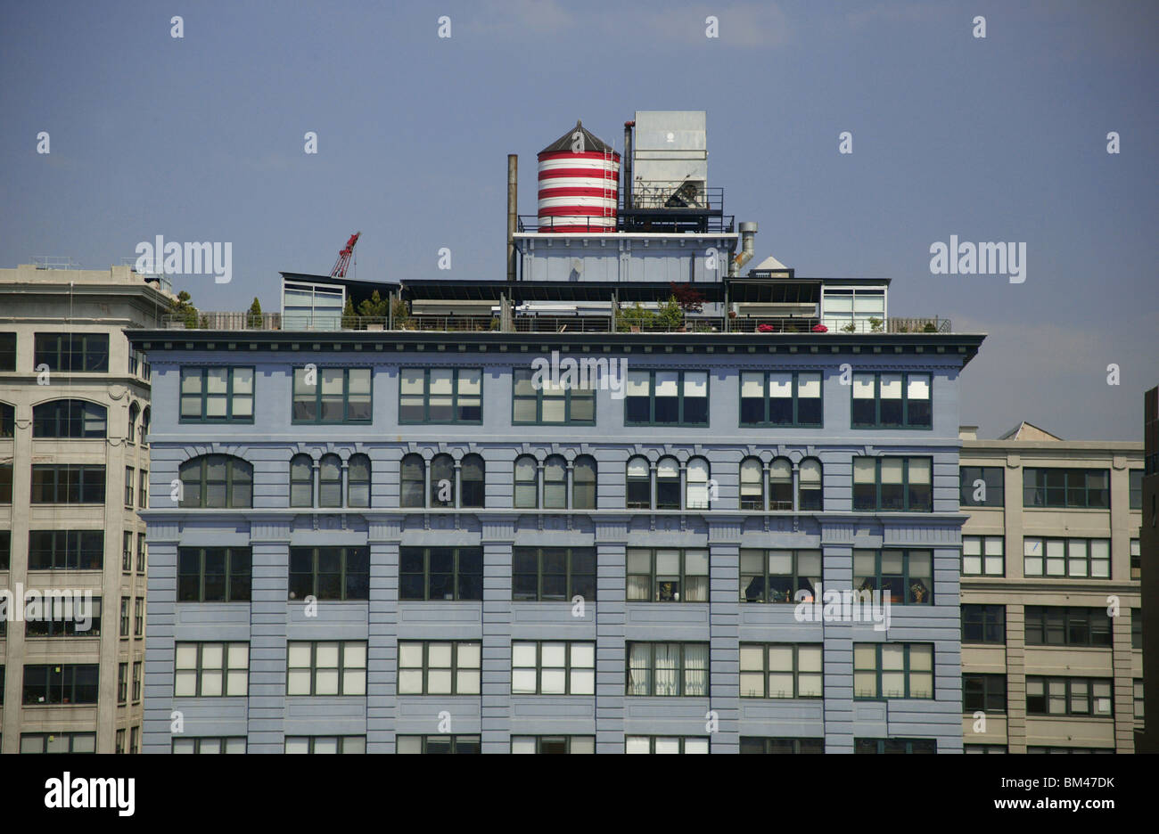 blue building with water tank Stock Photo - Alamy