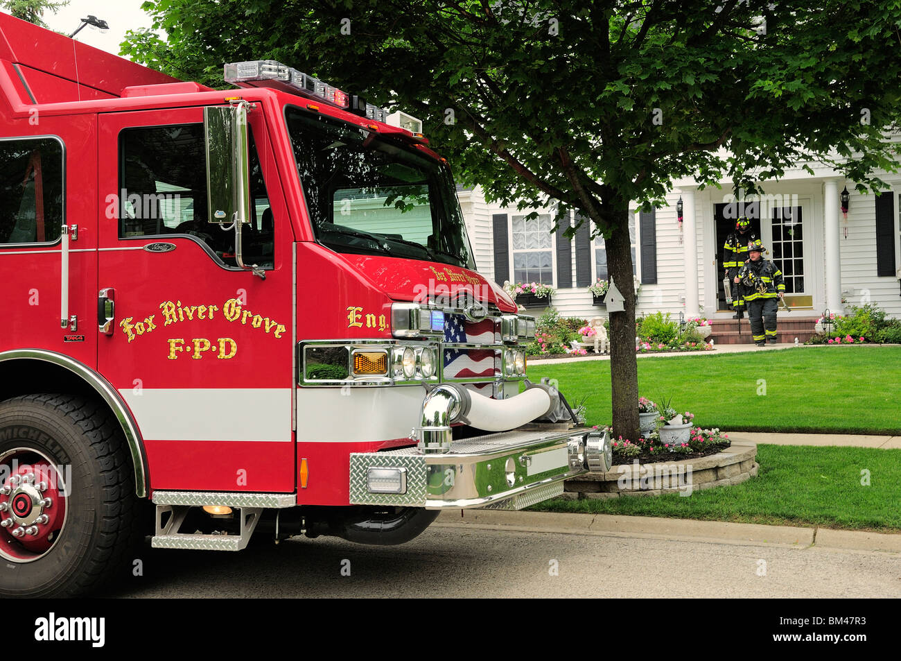 Side close-up view of fire engine during suburban call. Note American ...