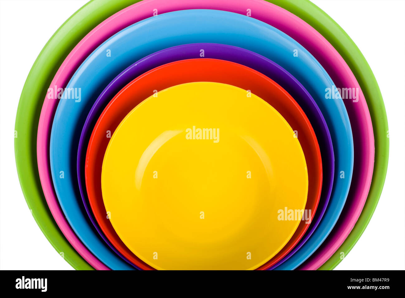 Stack of colorful plastic bowls over white background Stock Photo - Alamy