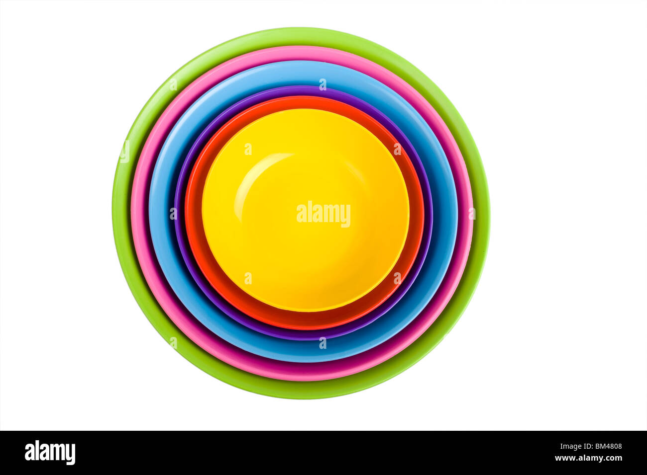 Stack of colorful plastic bowls over white background Stock Photo - Alamy