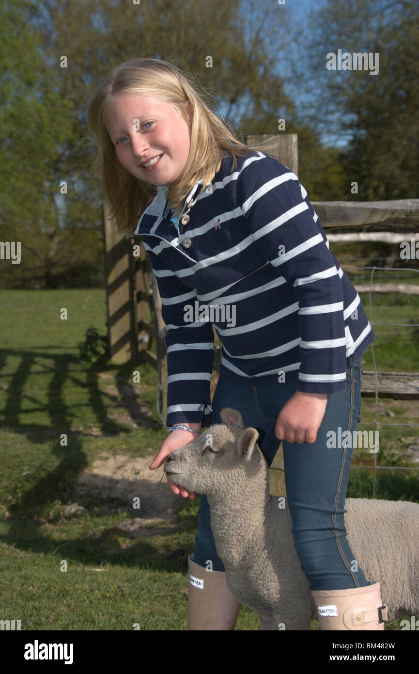 young girl with lamb Stock Photo - Alamy