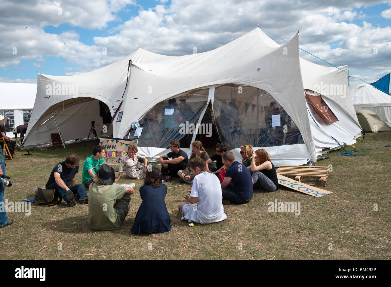 An open-air environmental discussion taking place in a circle at the ...