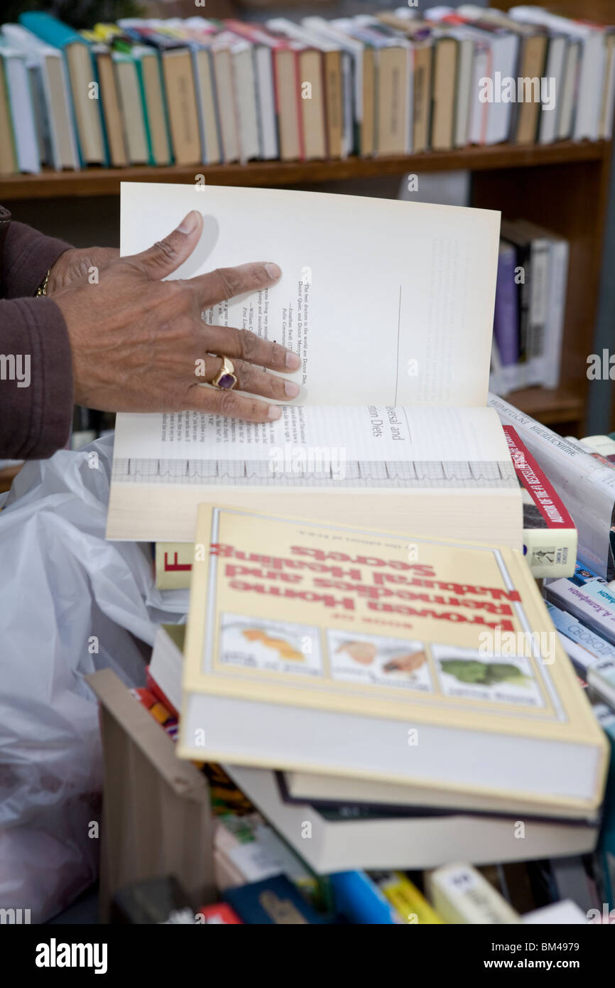 African american woman opening book hi-res stock photography and images ...