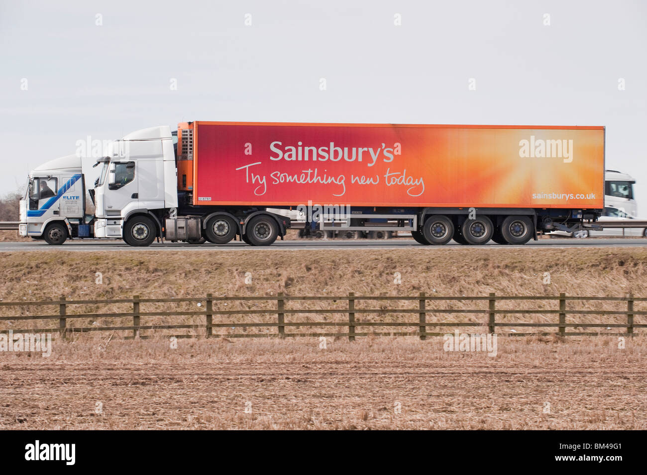 A lorry transporting goods for Sainsbury's, travelling along a motorway ...