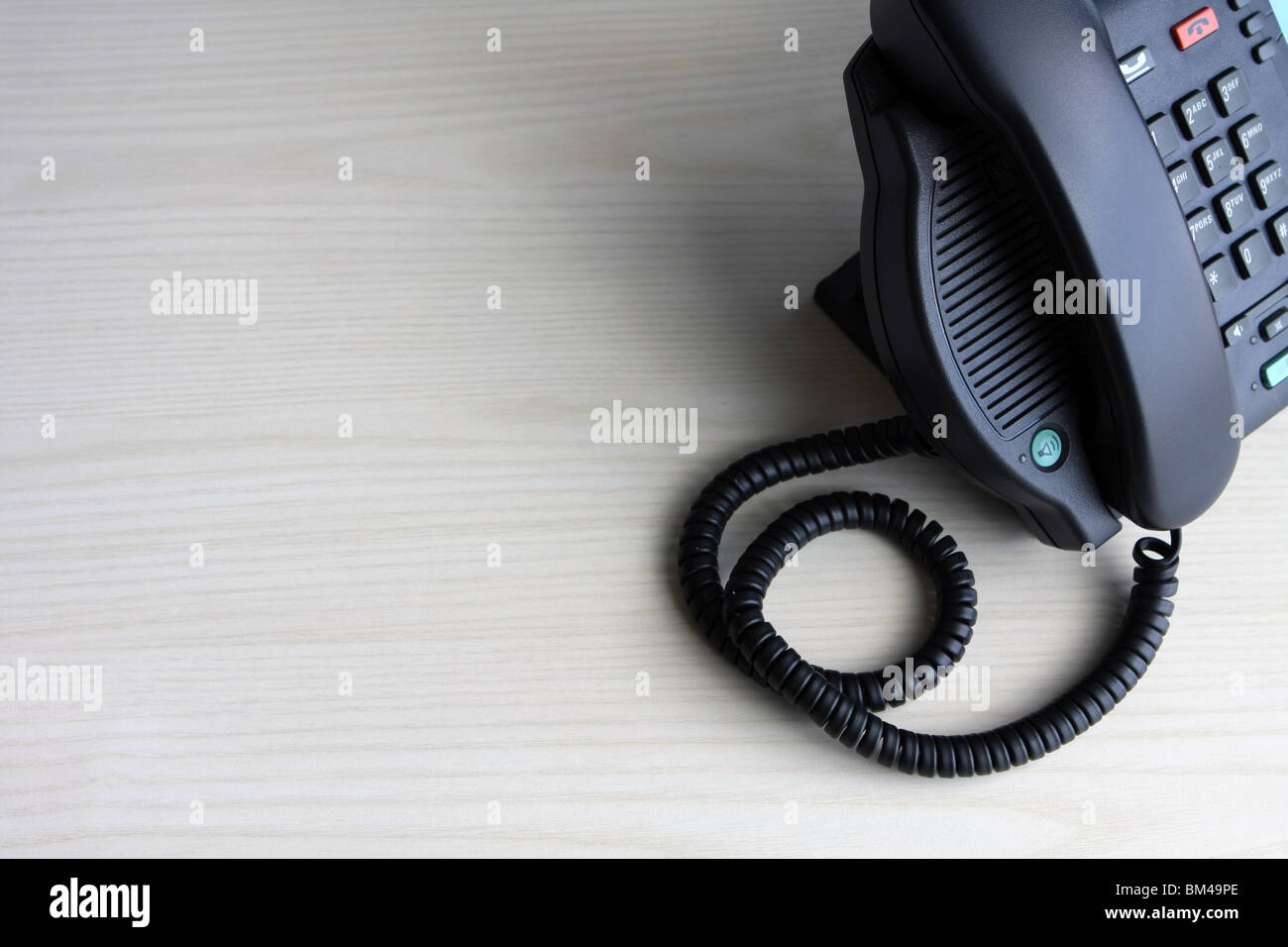 part of a telephone with the receiver on the hook Stock Photo - Alamy