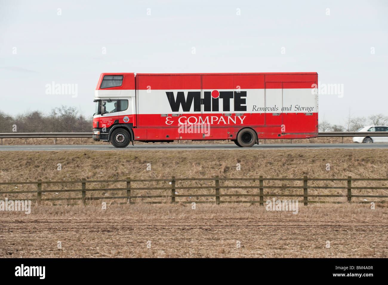 A removal lorry working for White & Company, travelling along a ...