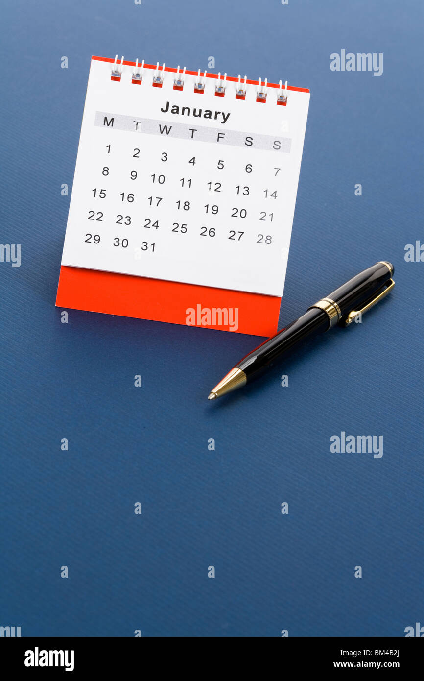 Calendar January close up with blue background Stock Photo - Alamy