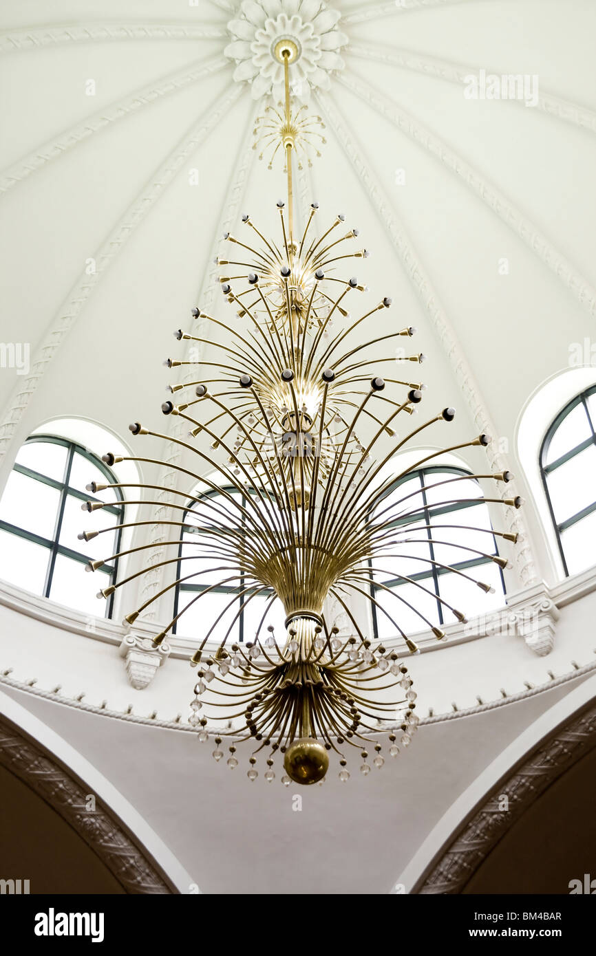 Beautiful and dear modern chandelier in vault hall Stock Photo - Alamy