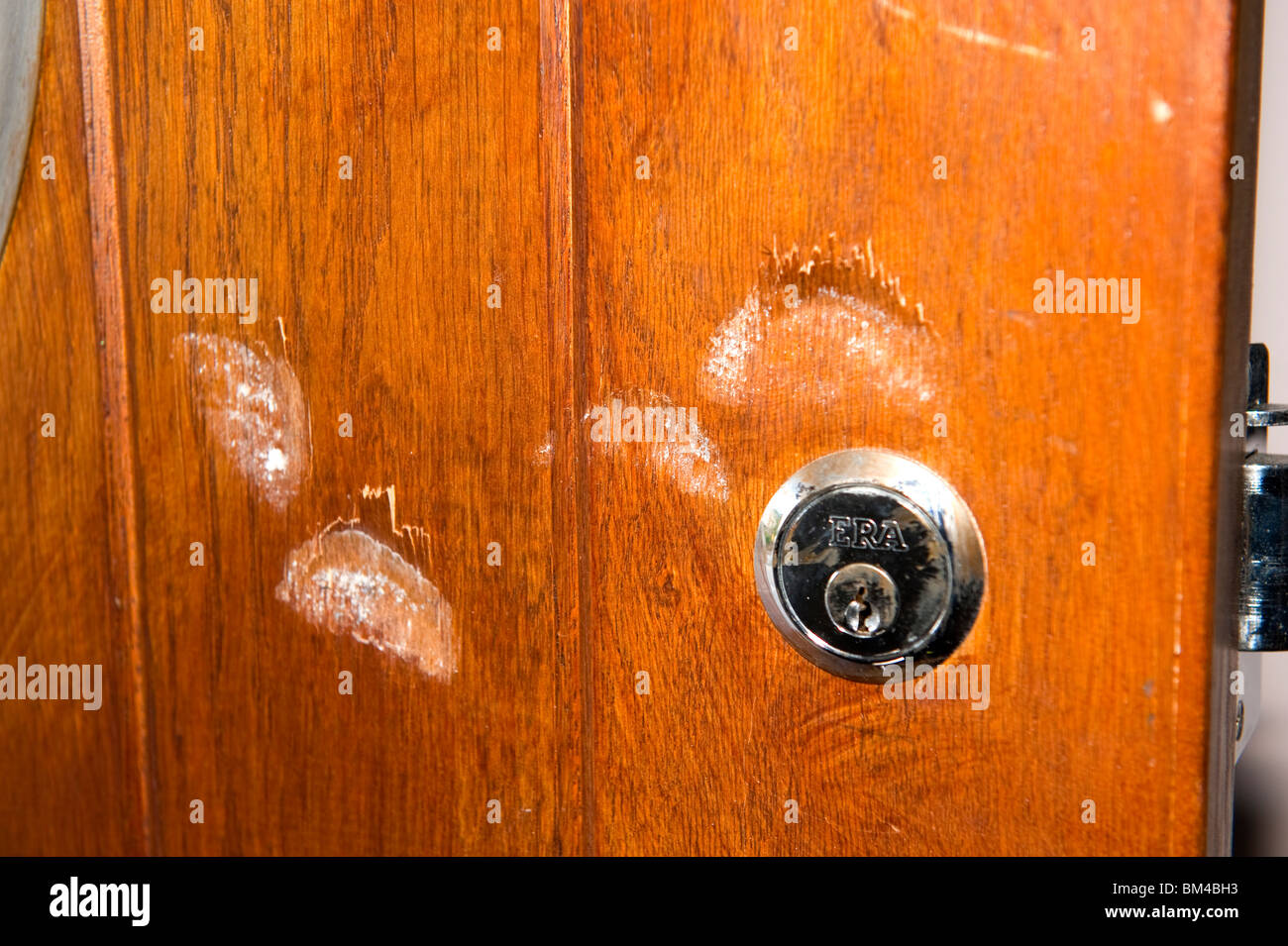 Door smashed in with sledge hammer Stock Photo - Alamy