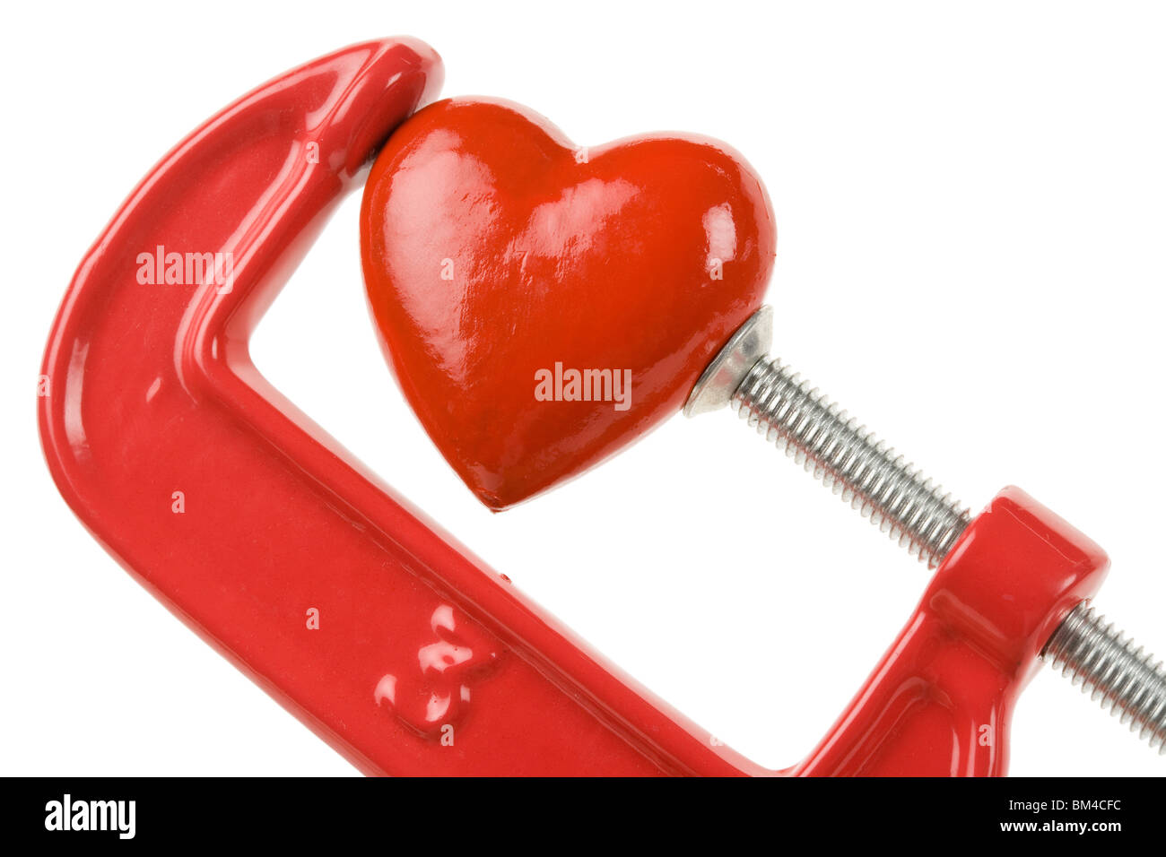 Vise Grip and red heart, concept of stress, sadness, heart broken, Pain ...