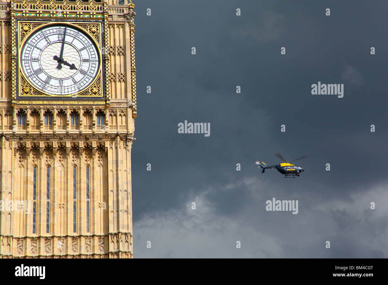 Police helicopter flies around Big Ben in London, England during the ...