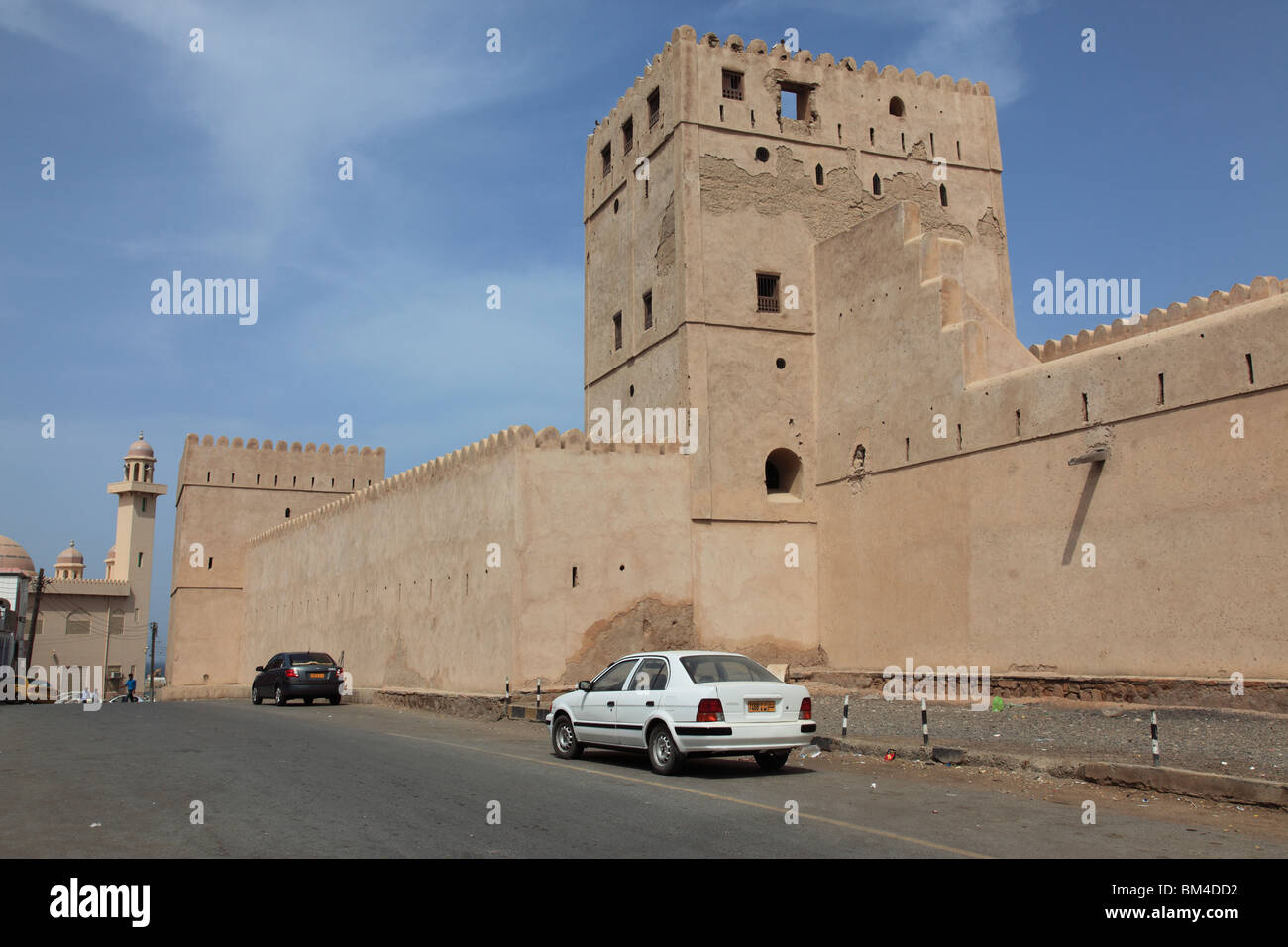 restored tower and outside fortified wall of historic Fort Al-Suwaiq at ...
