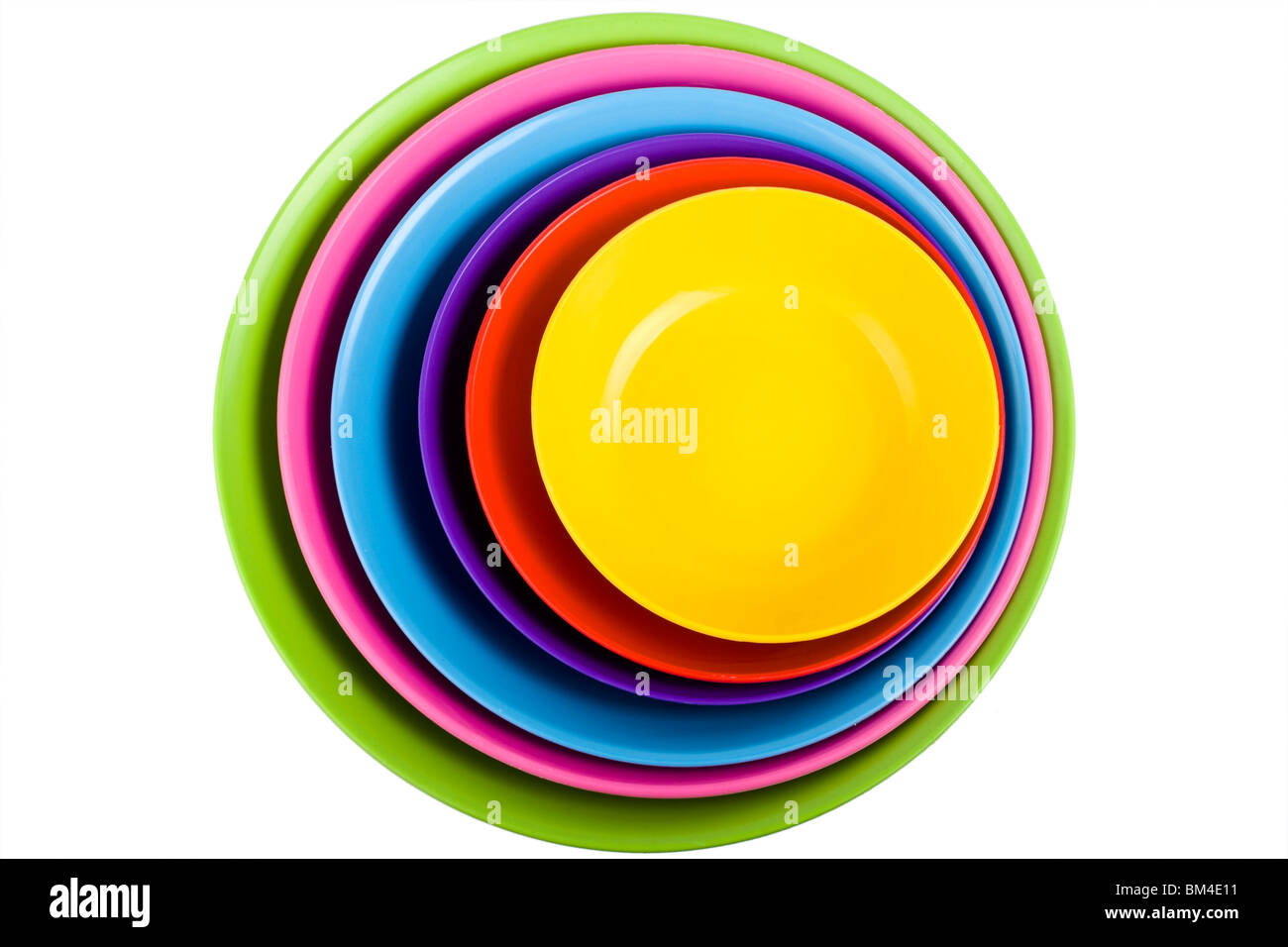 Stack of colorful plastic bowls over white background Stock Photo - Alamy