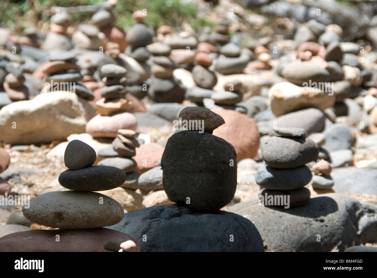 Pebbles arranged as standing stone sculptures at Oak Creek River in Red ...