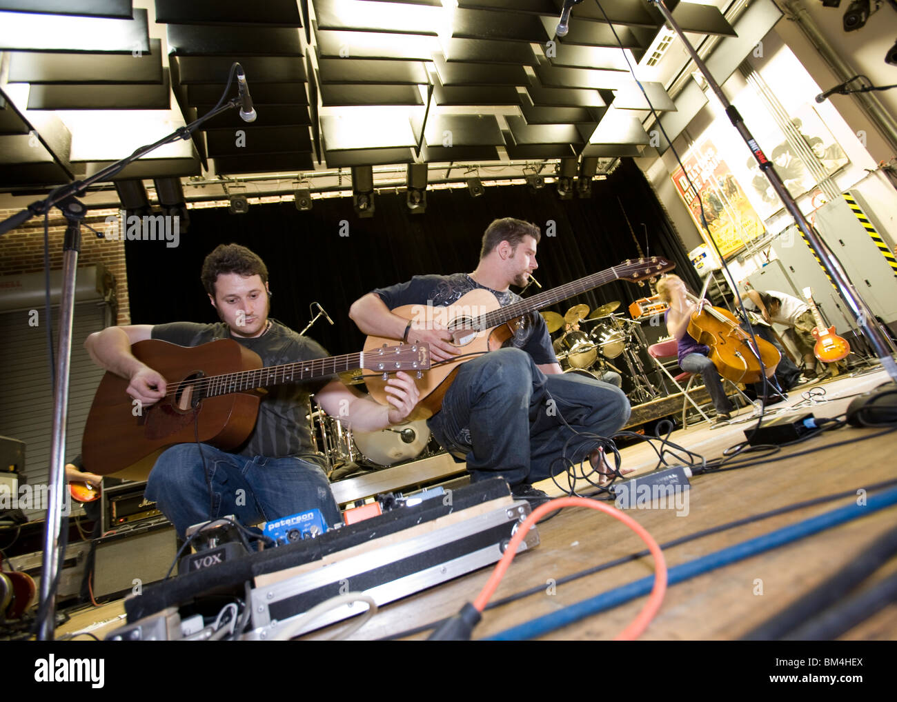 Rock band guitarists tuning up Stock Photo - Alamy