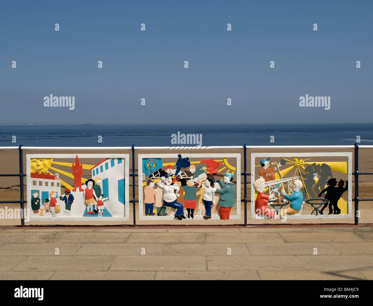 Spring at the seaside a handrail on the promenade at Redcar decorated ...