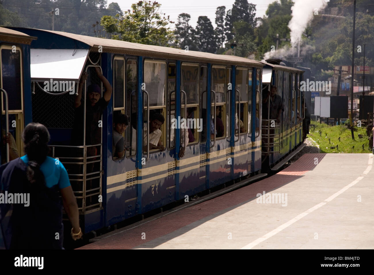 The steam powered train arrives at Coonoor station in Tamil Nadu, India ...