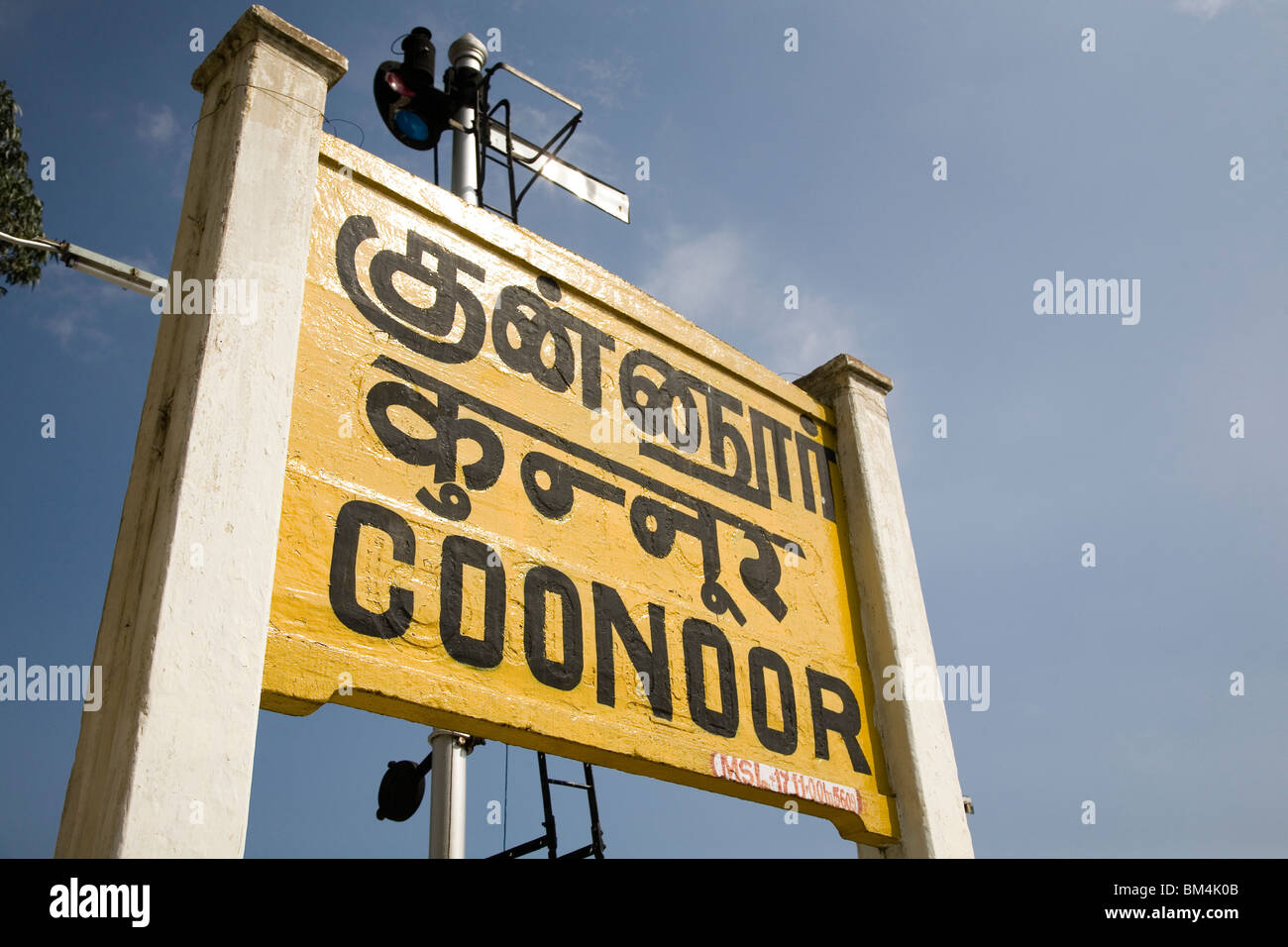 The sign for Coonoor station is written in English, Hindi and Tamil ...