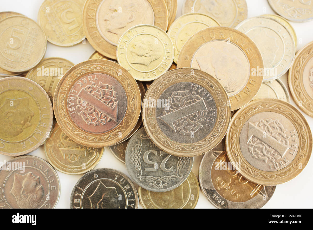 Small heap of turkish coins on a white background Stock Photo - Alamy