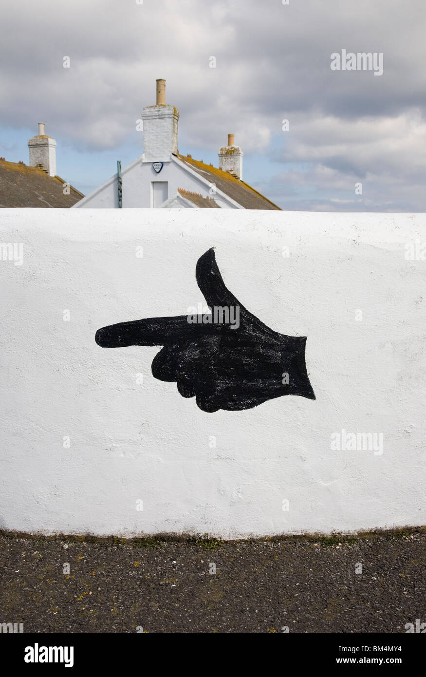 painted hand on wall with finger pointing the way Stock Photo - Alamy