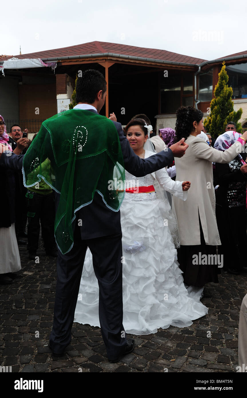 Turkish Bride and Groom dancing in the street on their wedding day ...