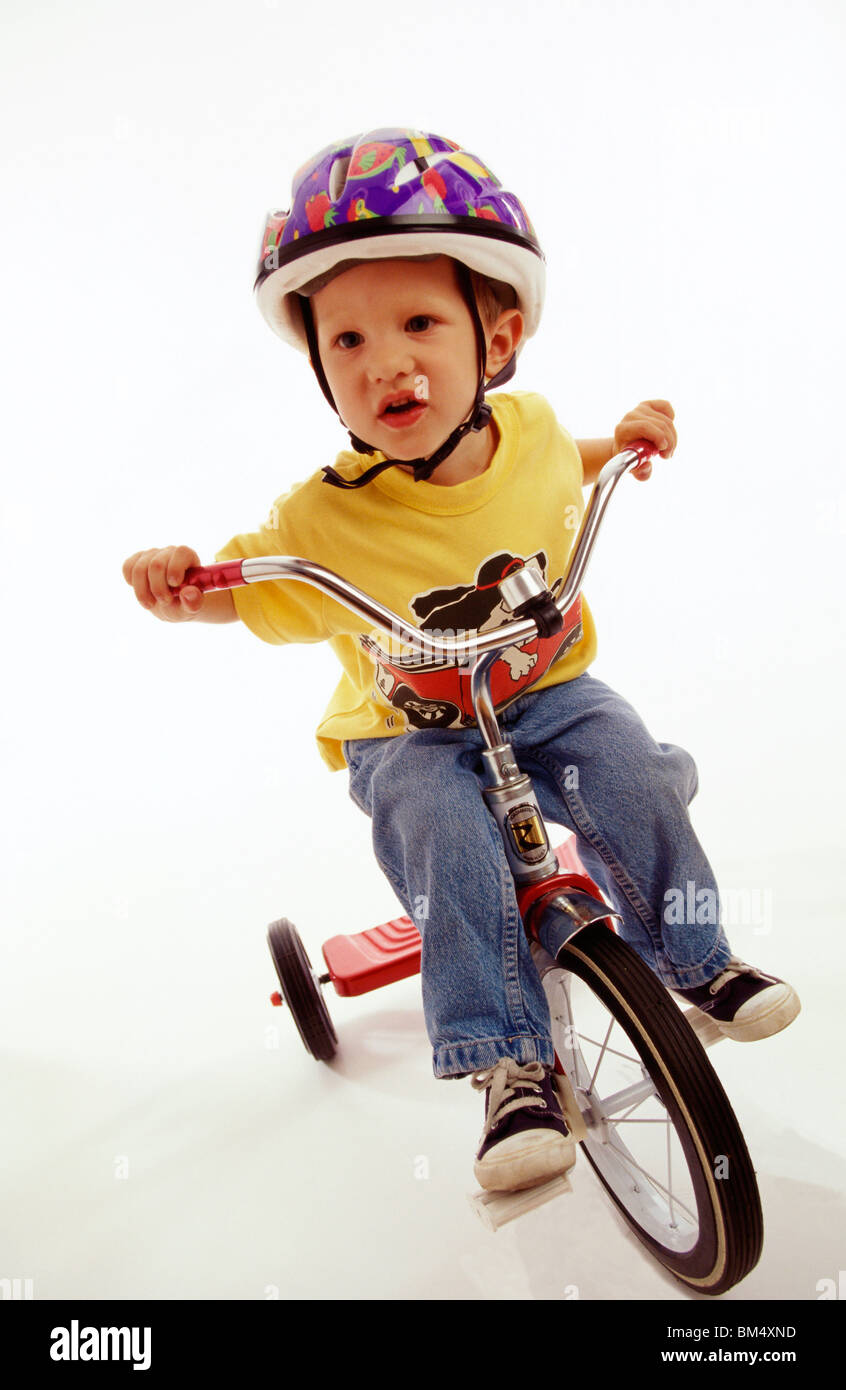 Child on tricycle hi-res stock photography and images - Alamy