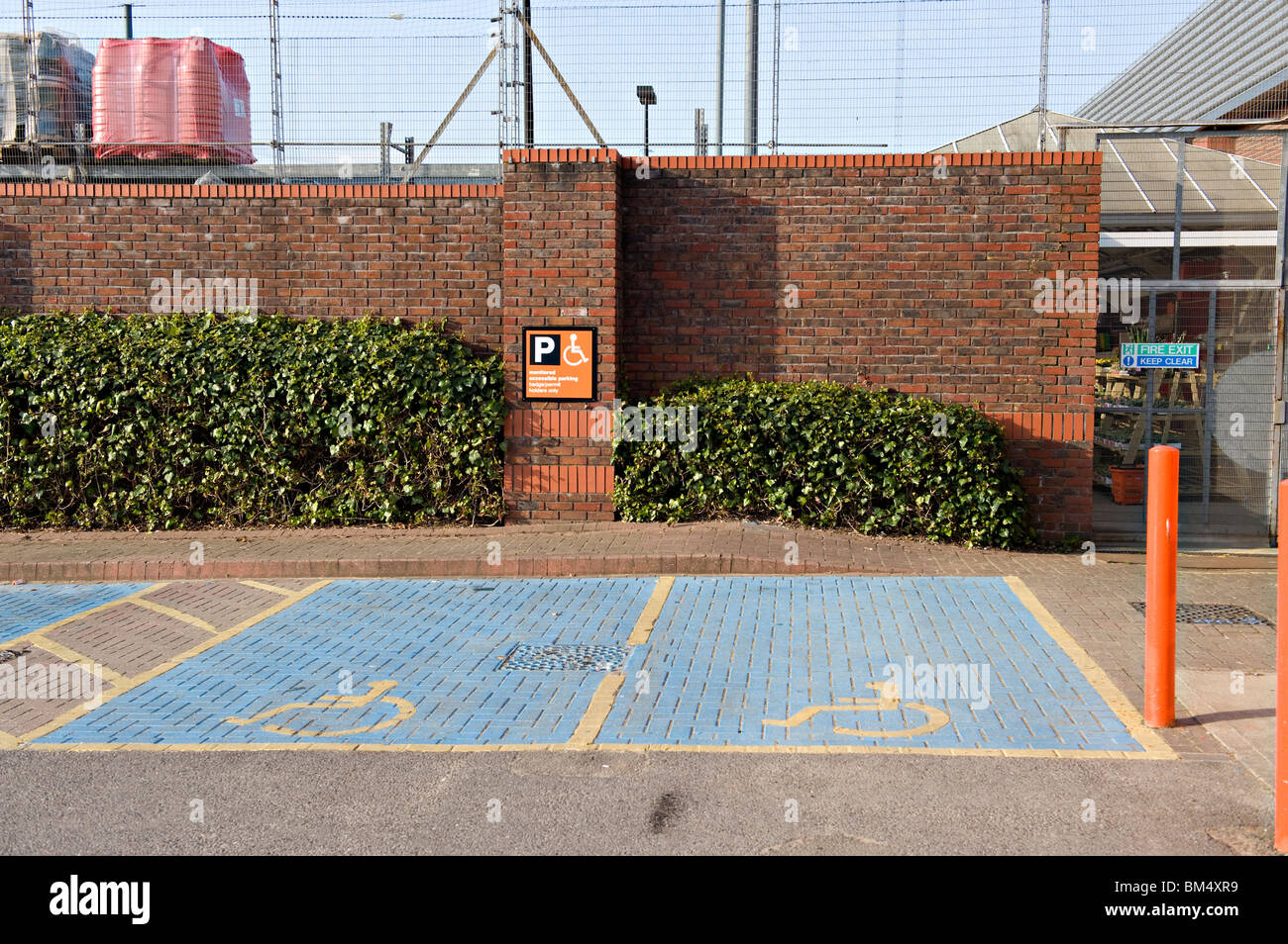 Disabled parking bay in a car park Stock Photo - Alamy
