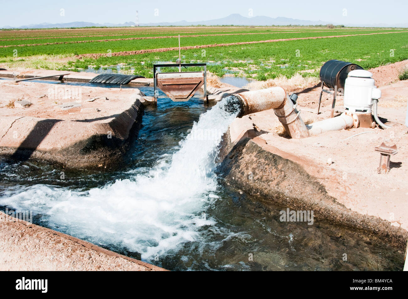 water is pumped into an irrigation canal in Arizona Stock Photo - Alamy