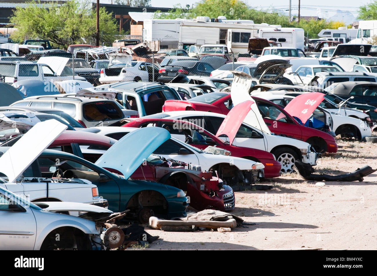 cars in a salvage yard being used to recycle parts Stock Photo - Alamy