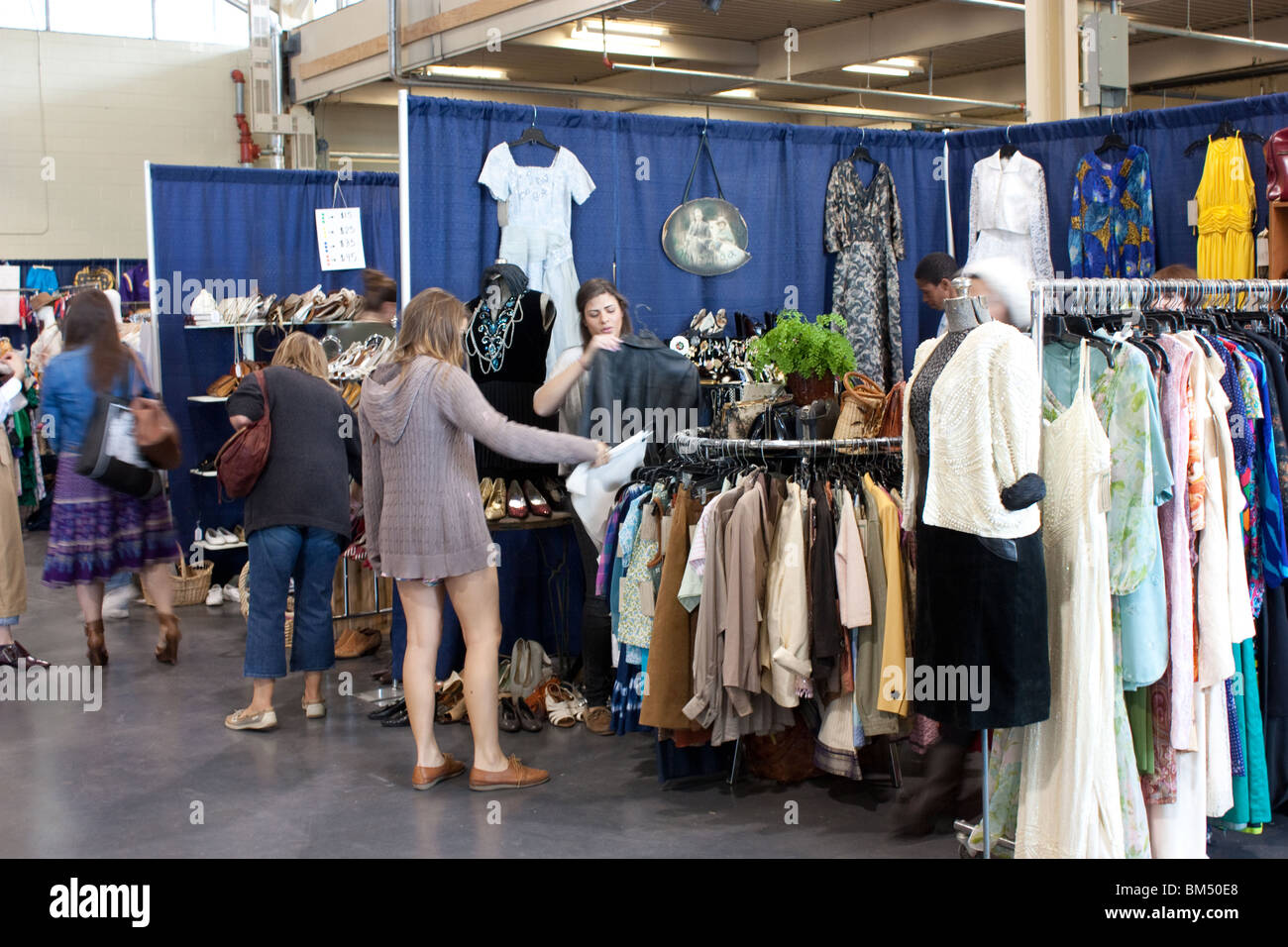 female shoppers clothing rack Stock Photo - Alamy