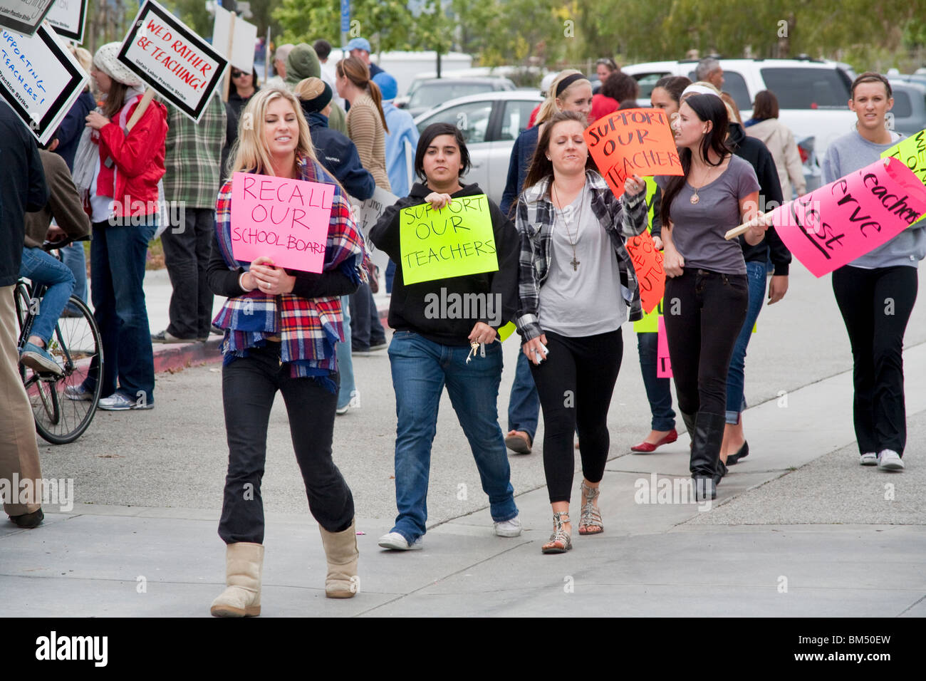 Carrying signs, students support protesting school teachers' rally over ...
