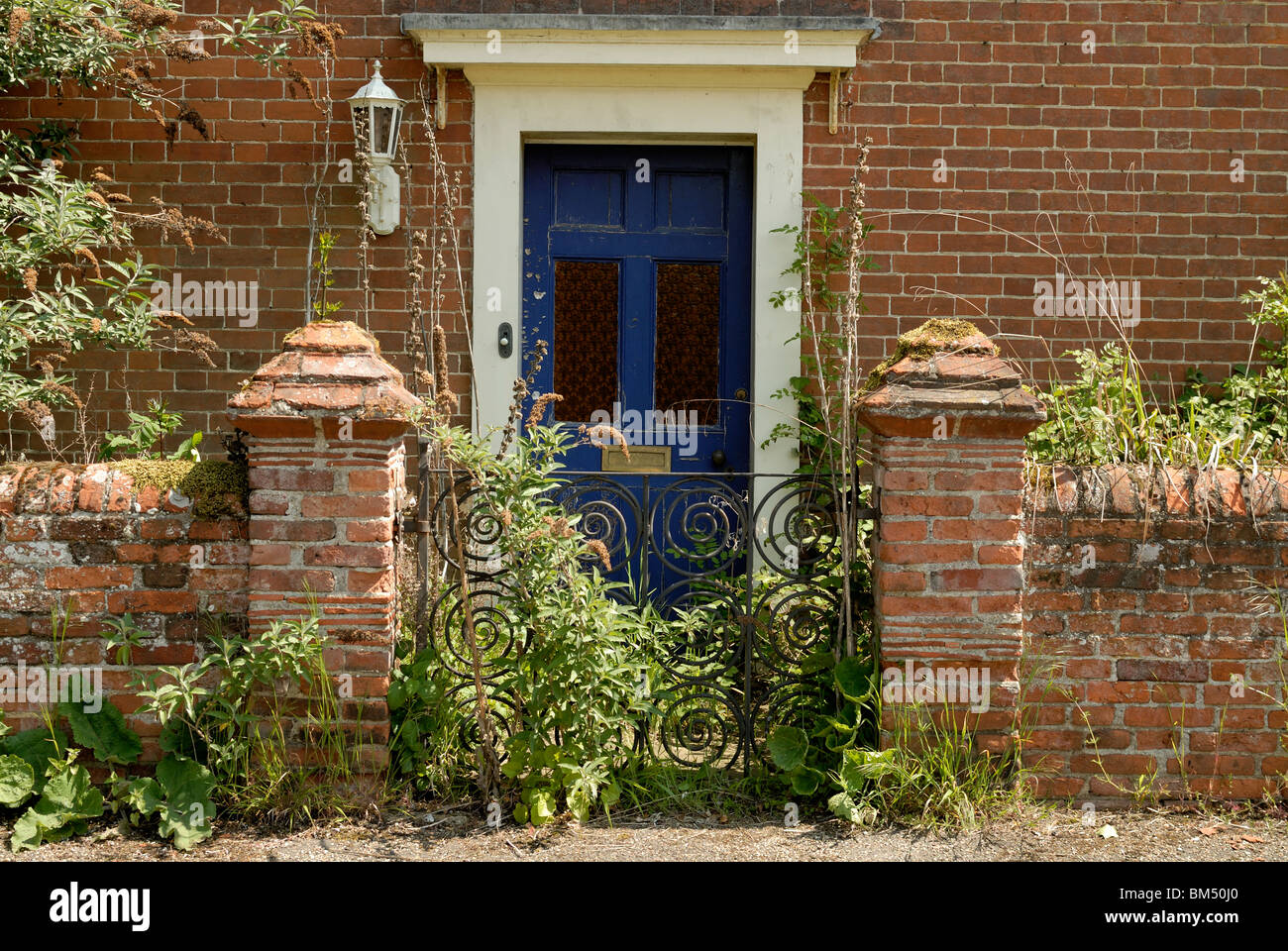 The closed front door of an empty abandoned house, with the gateway ...