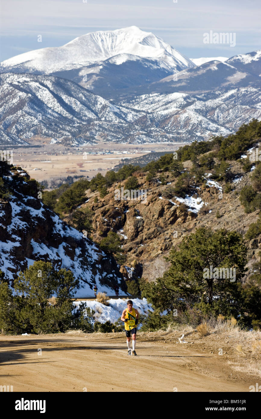 Runner competes in a marathon race near the small mountain town of ...