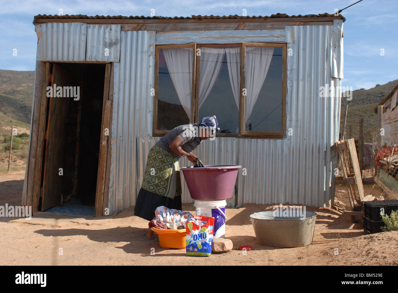 Woman, washing clothes Stock Photo - Alamy