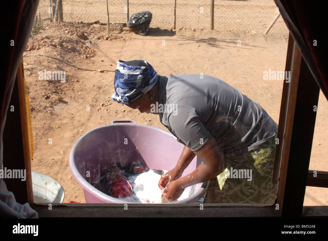Woman, washing clothes Stock Photo - Alamy