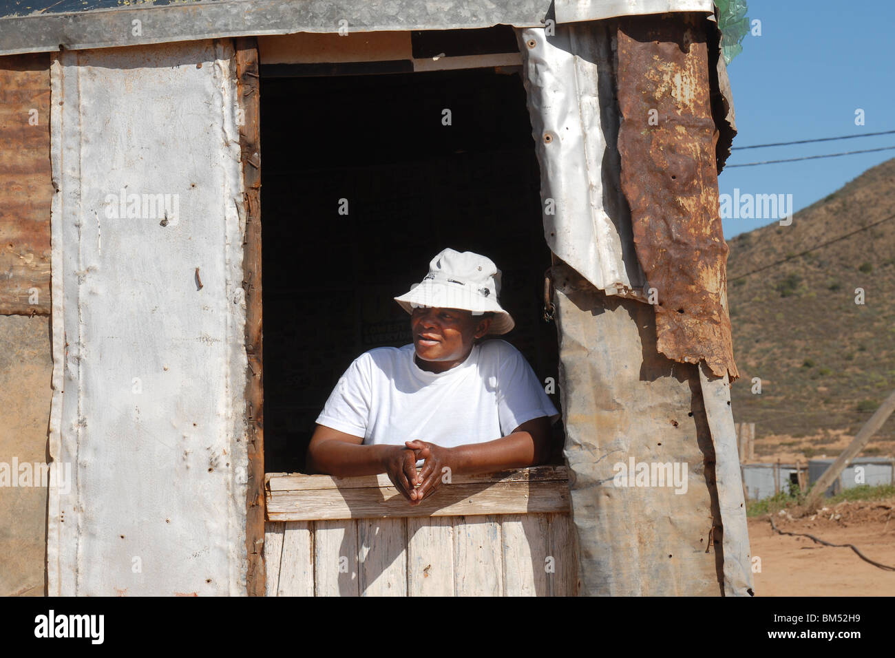 Woman, hanging around in her shack Stock Photo - Alamy