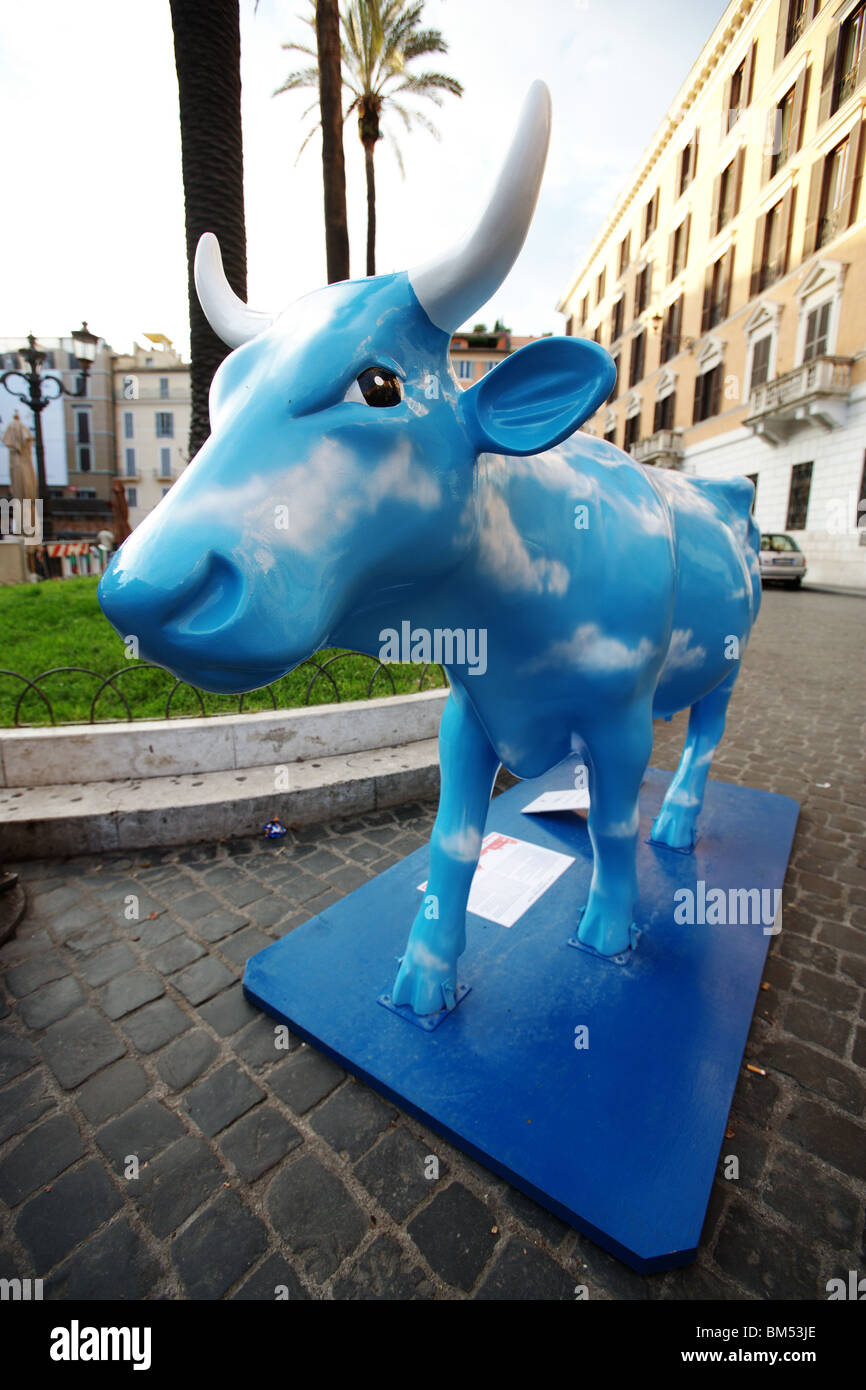 Cow parade, artistic word movement display a plastic blue cow in the ...