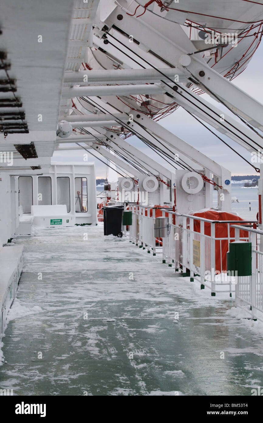 Ice-covered deck of a passenger ferry on a cruise in the Baltic between ...