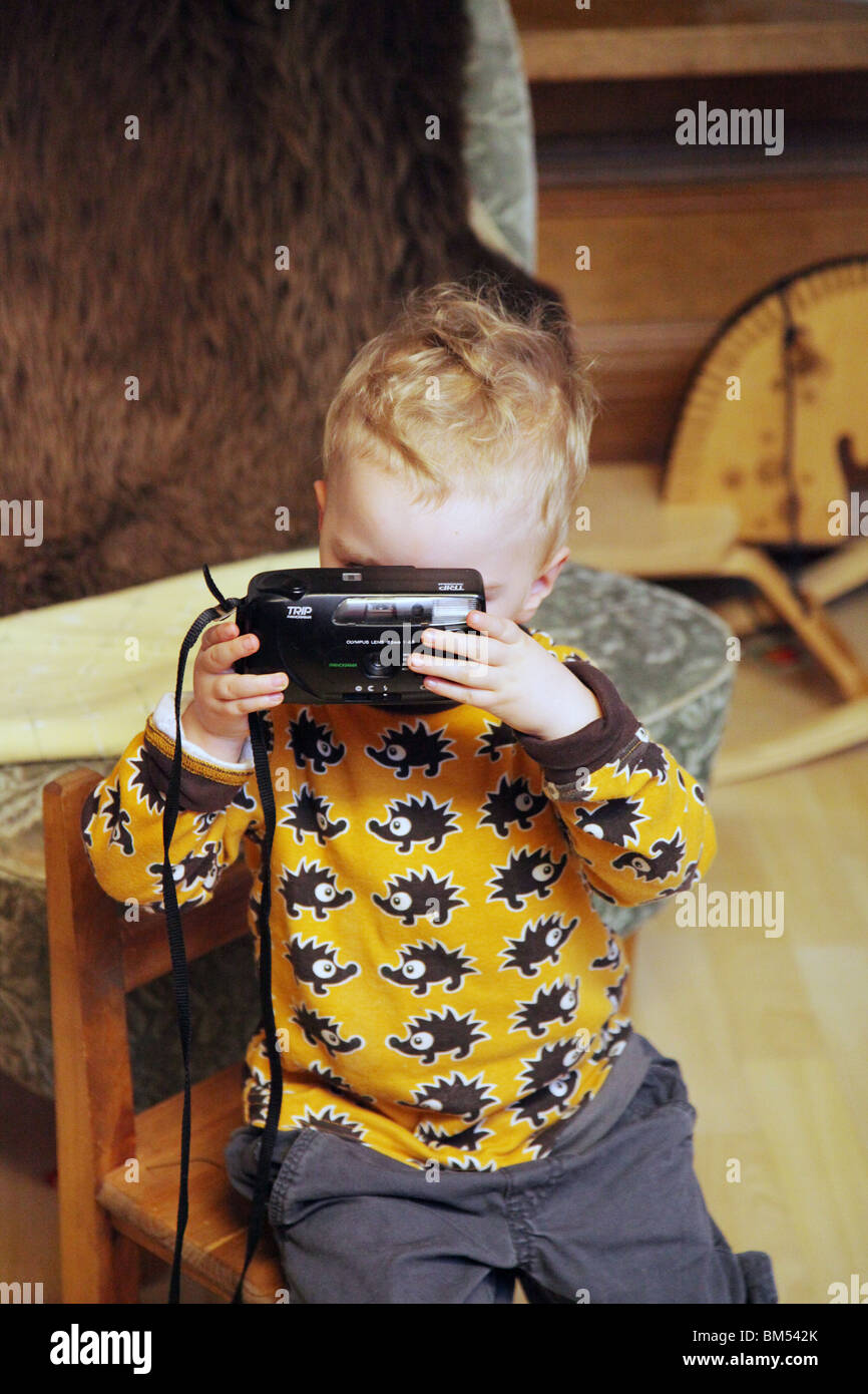 TODDLER WITH OLD FILM CAMERA: Two year old toddler child holding an old ...