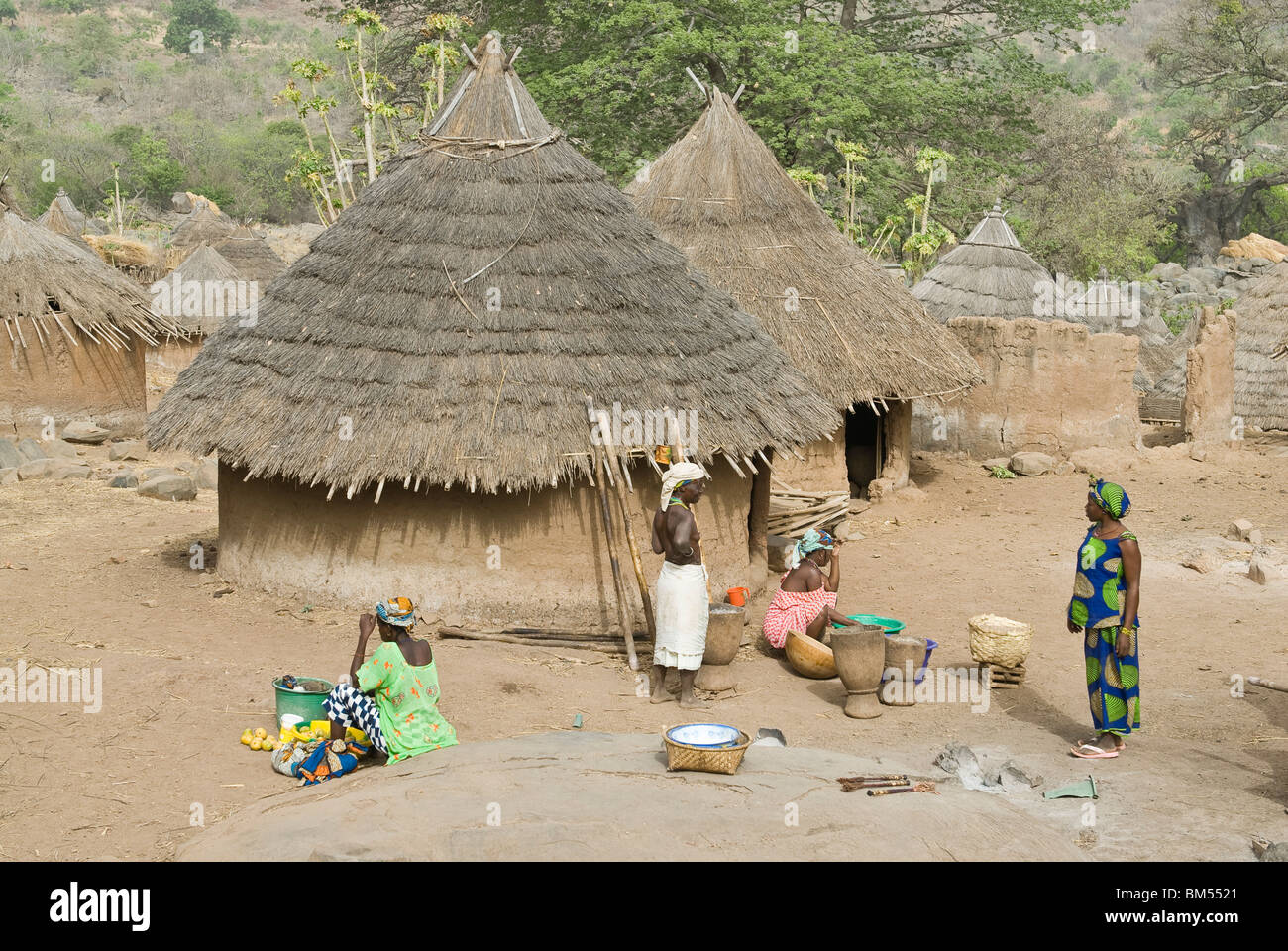 African bedik women preparing food, Iwol village, Bassari country ...