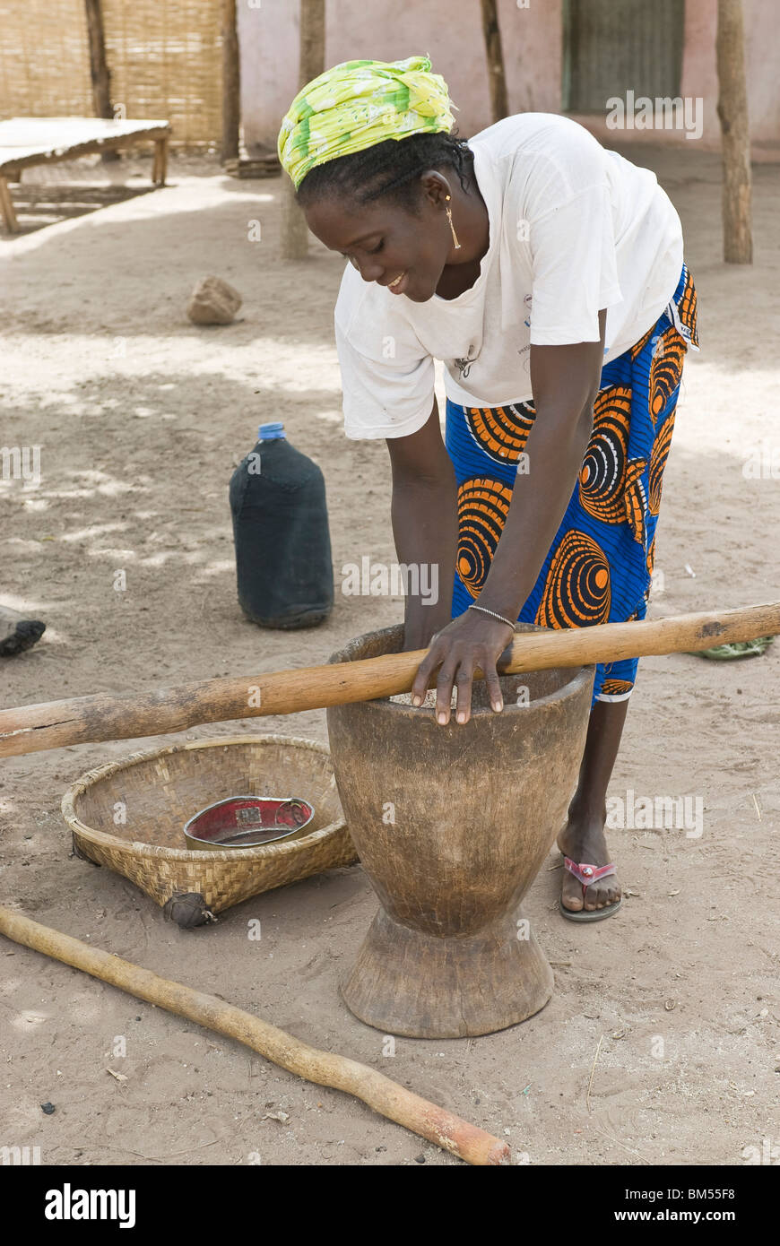 African woman pounding peanuts, Senegal, Africa Stock Photo - Alamy