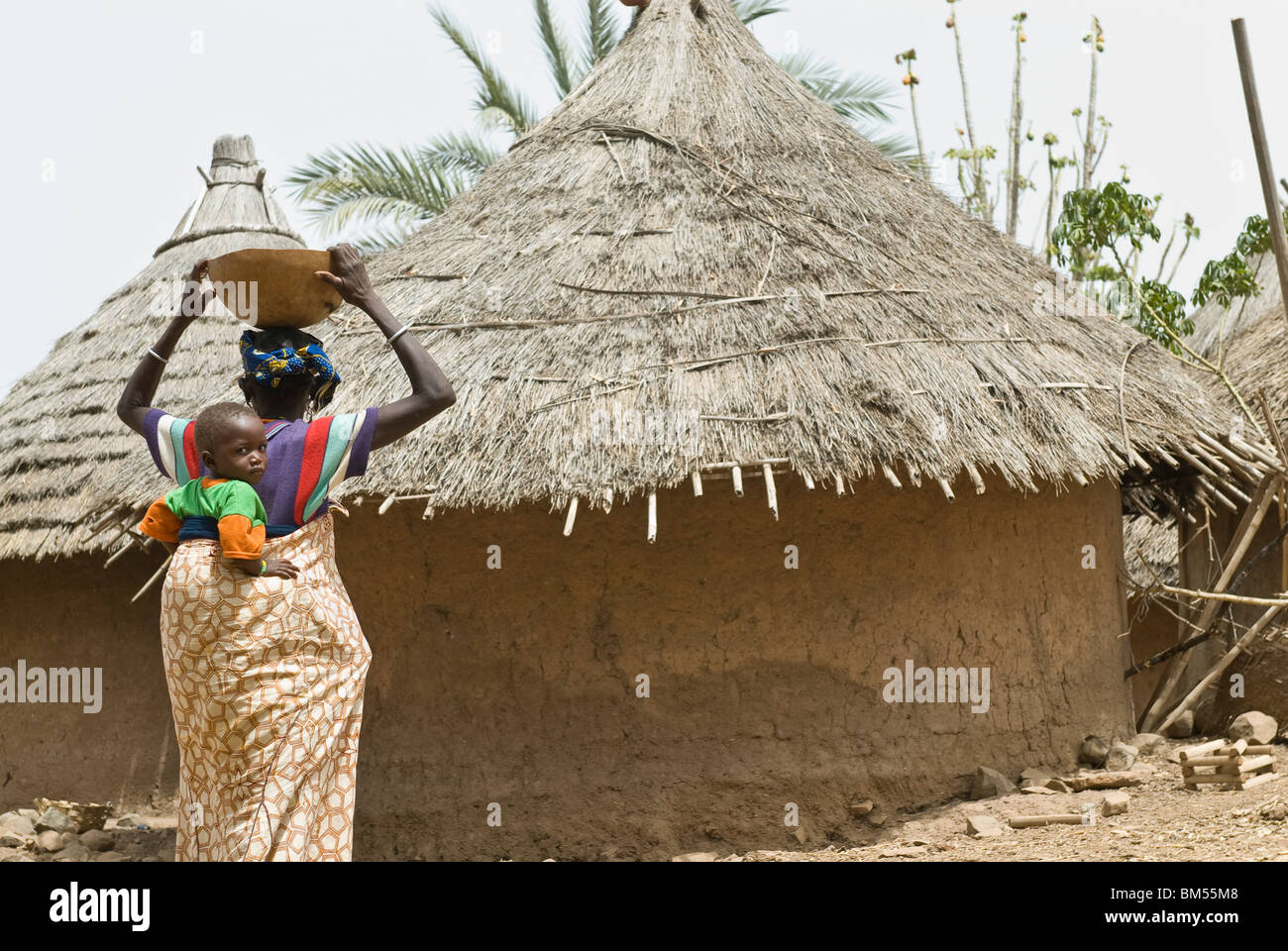 African bedik women carrying children, Iwol village, Bassari country ...