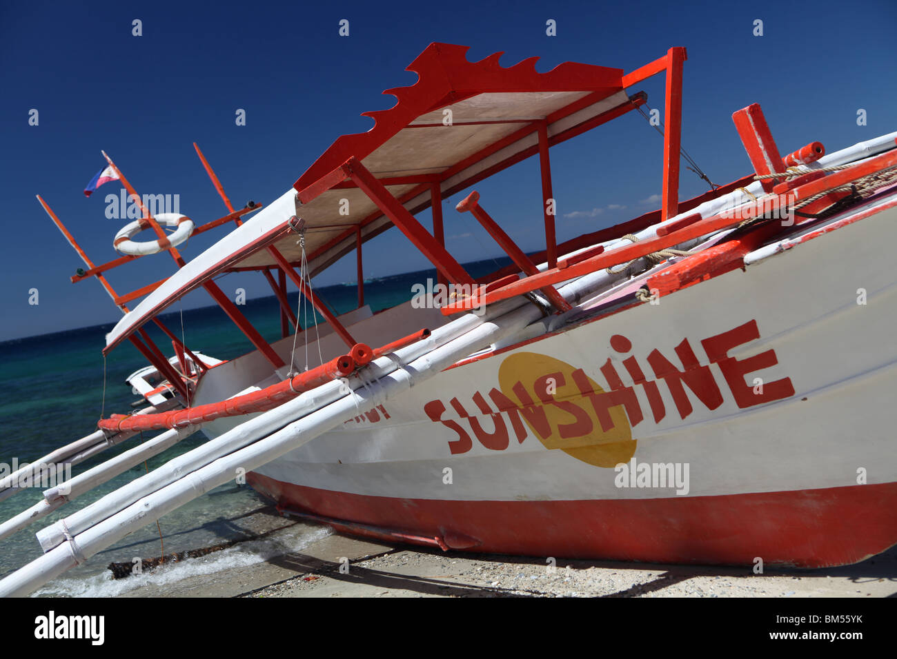 An outrigger boat on White Beach in the Puerto Galera region on north ...